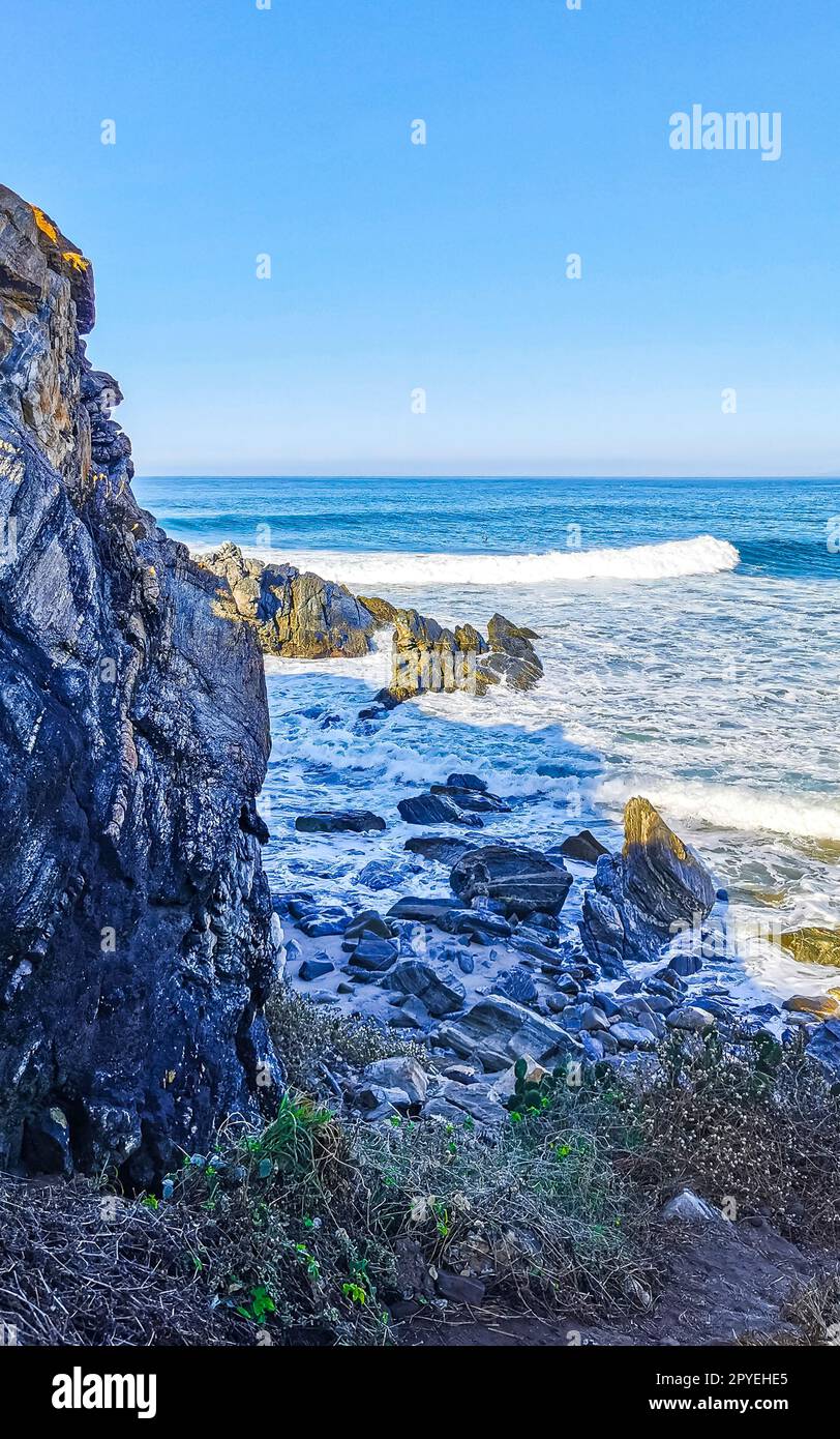 Beautiful rocks cliffs surfer waves at beach Puerto Escondido Mexico ...
