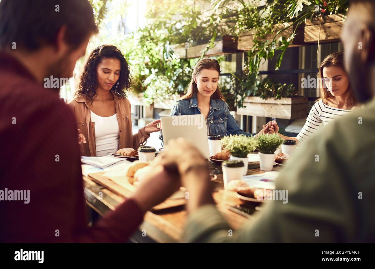 We keep winning because we keep believing. a group of coworkers holding ...