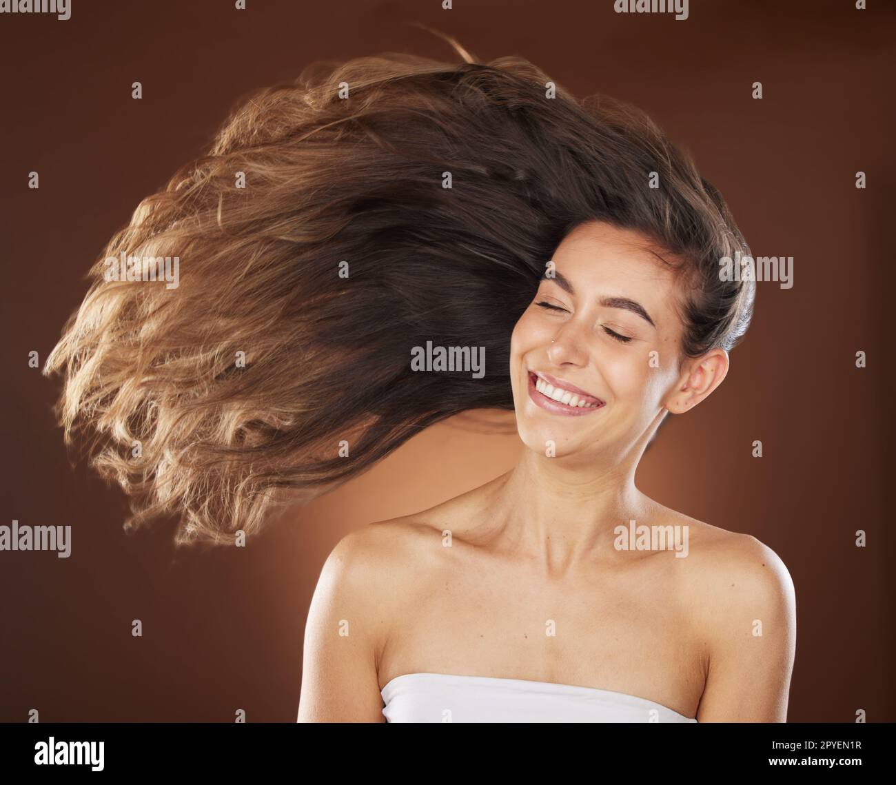 Hair, beauty and skincare with a model woman in studio on a brown ...