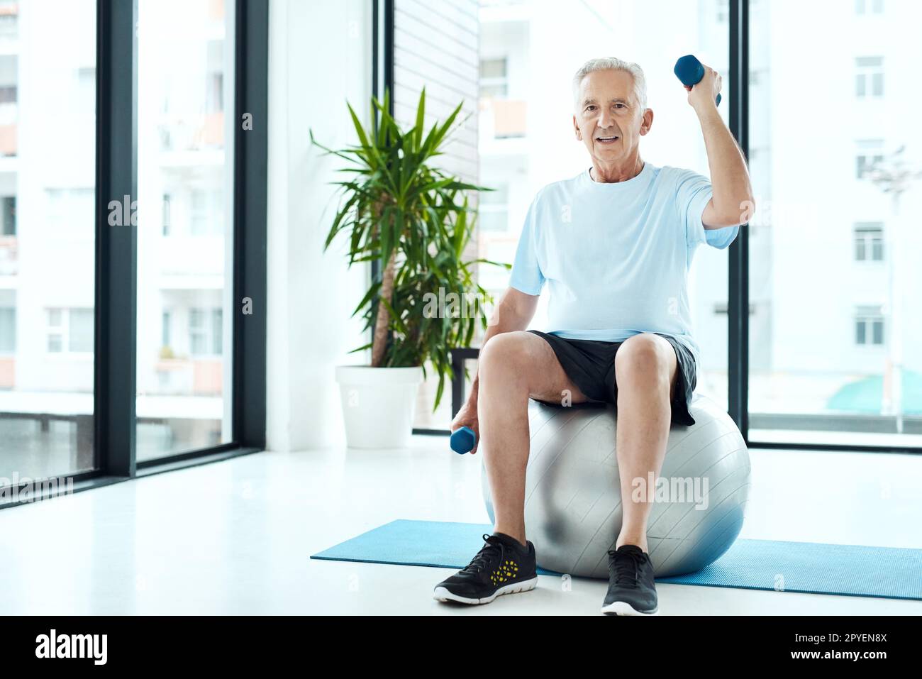 I might be old but Im still fit. a senior man working out with ...