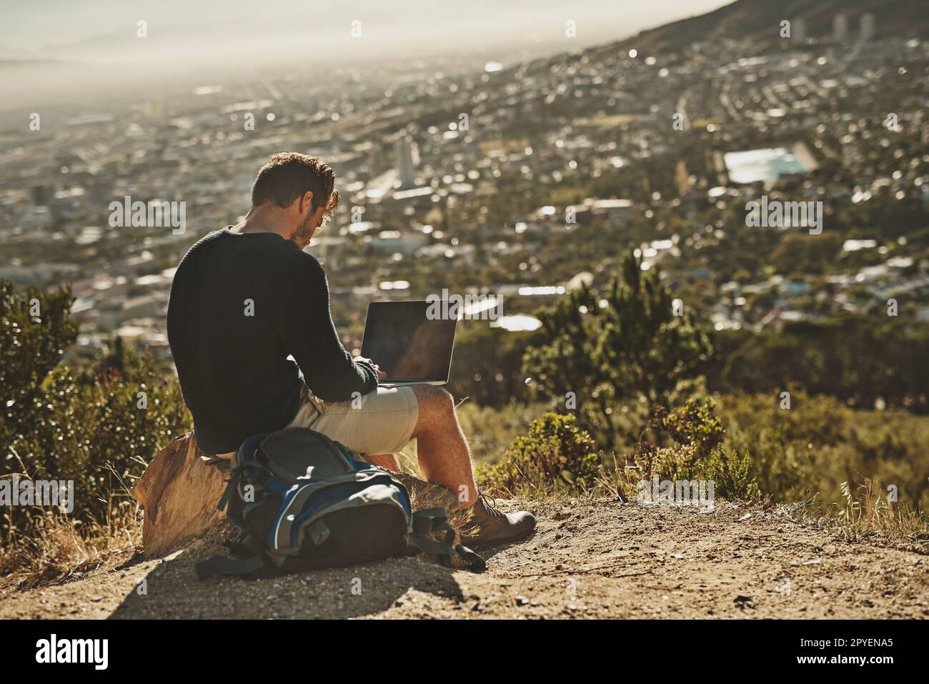 Go where inspiration takes you. a young man using his laptop while ...