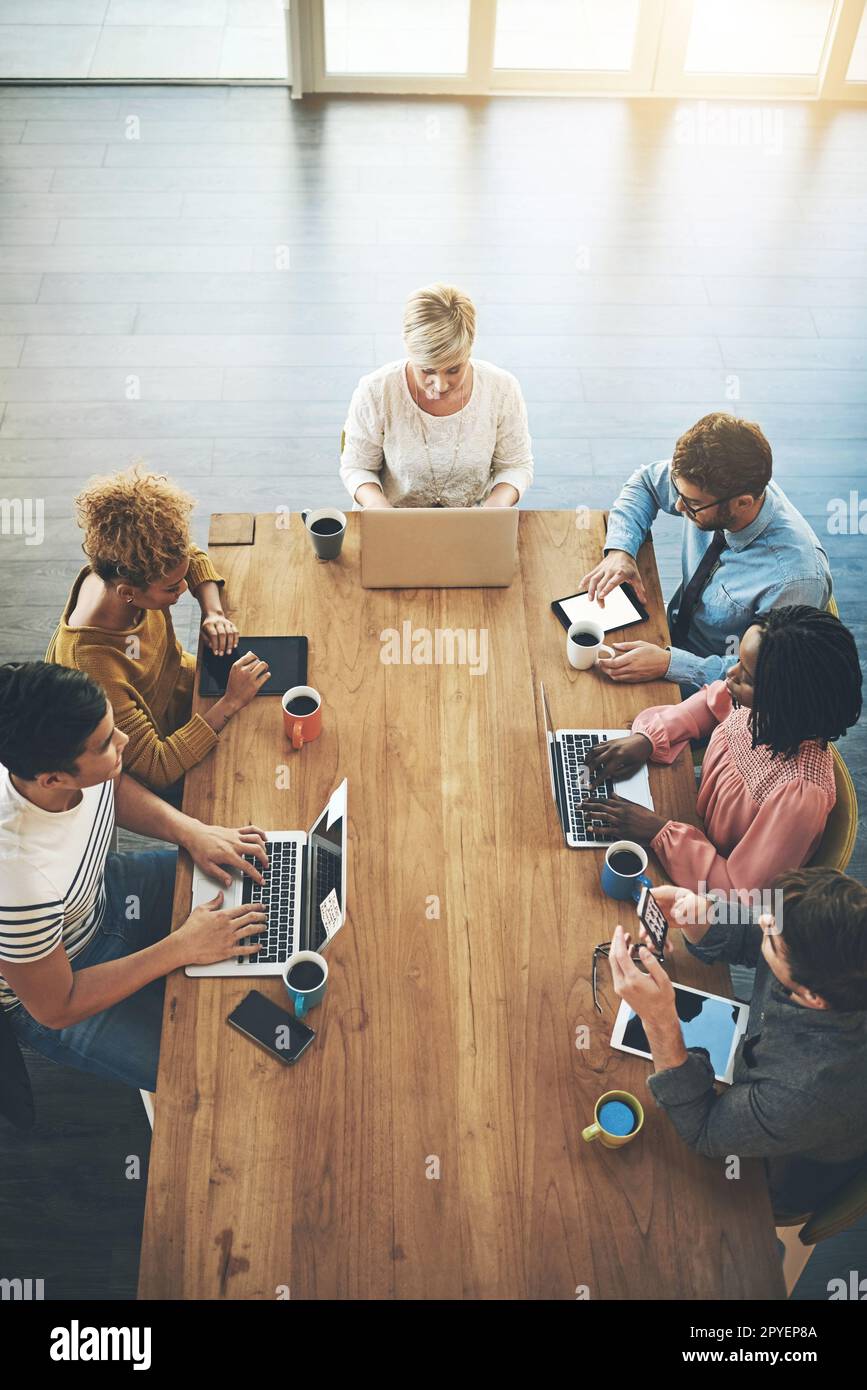 Focused on getting their tasks done. High angle shot of a group of ...