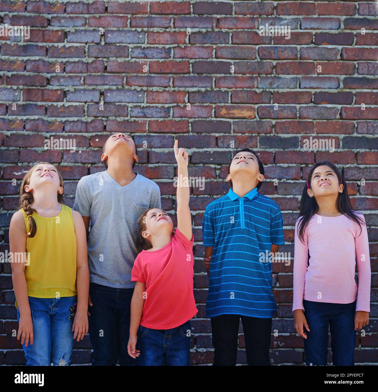 Aim up, you can achieve anything. a diverse group of children looking ...