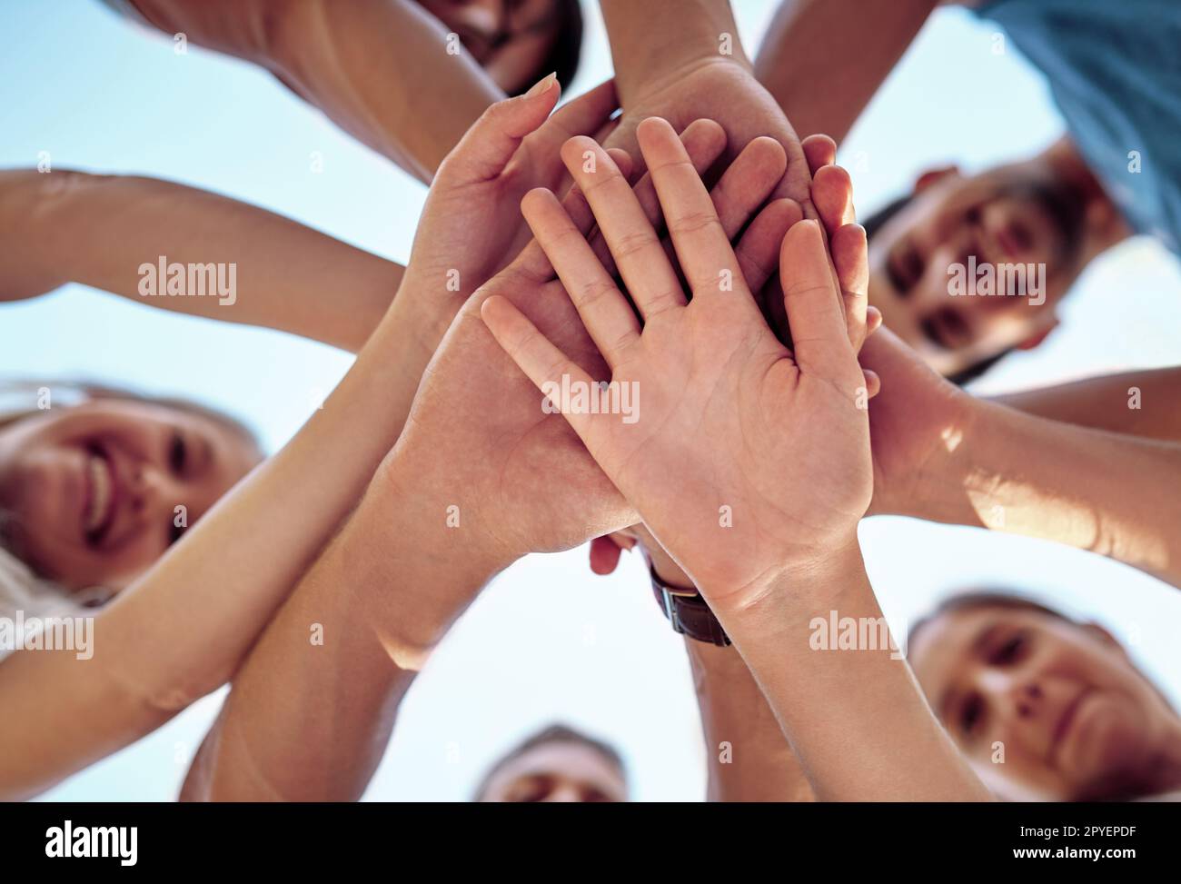 United in friendship. Low angle shot of a young group of friends ...