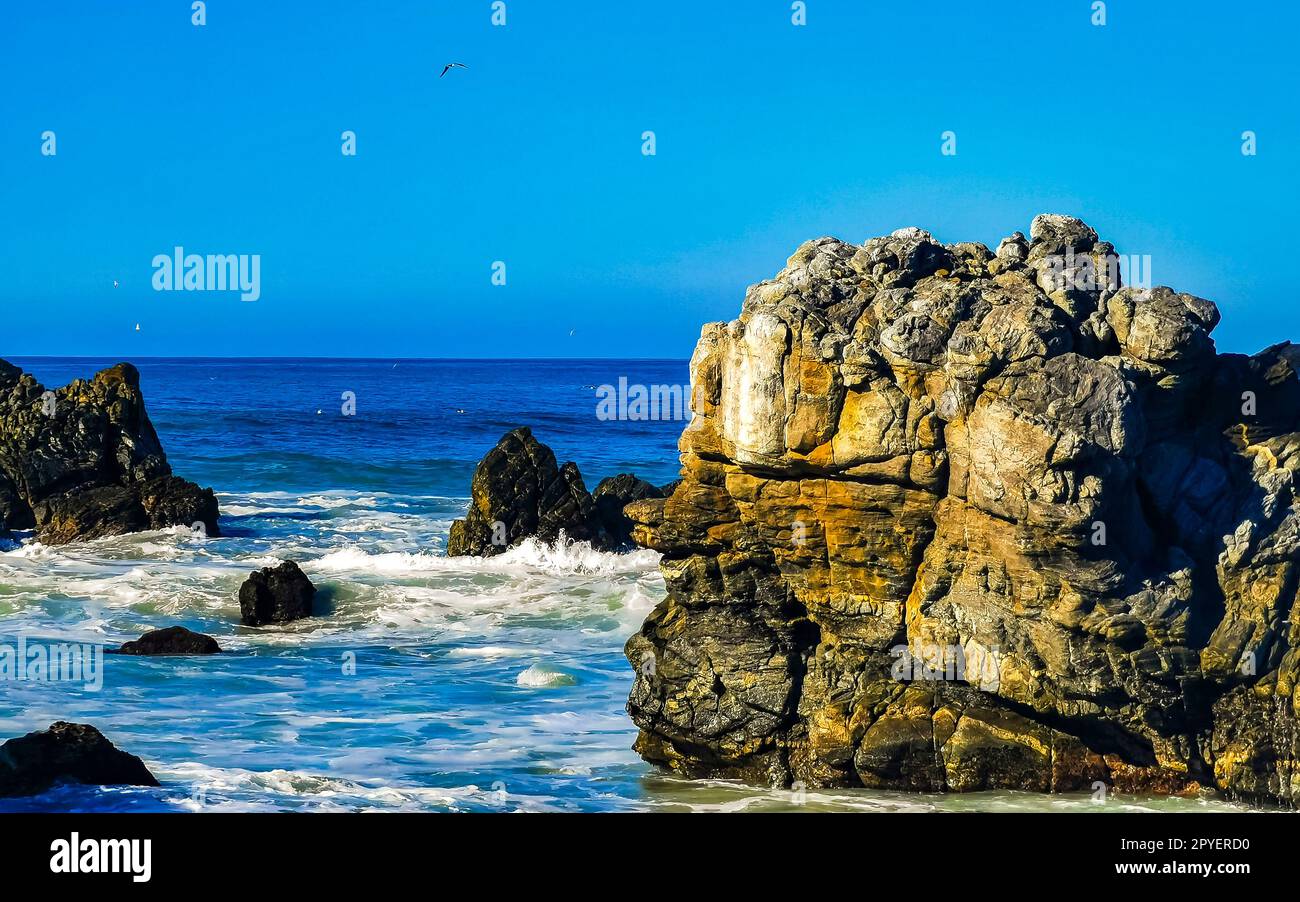 Beautiful rocks cliffs surfer waves at beach Puerto Escondido Mexico ...