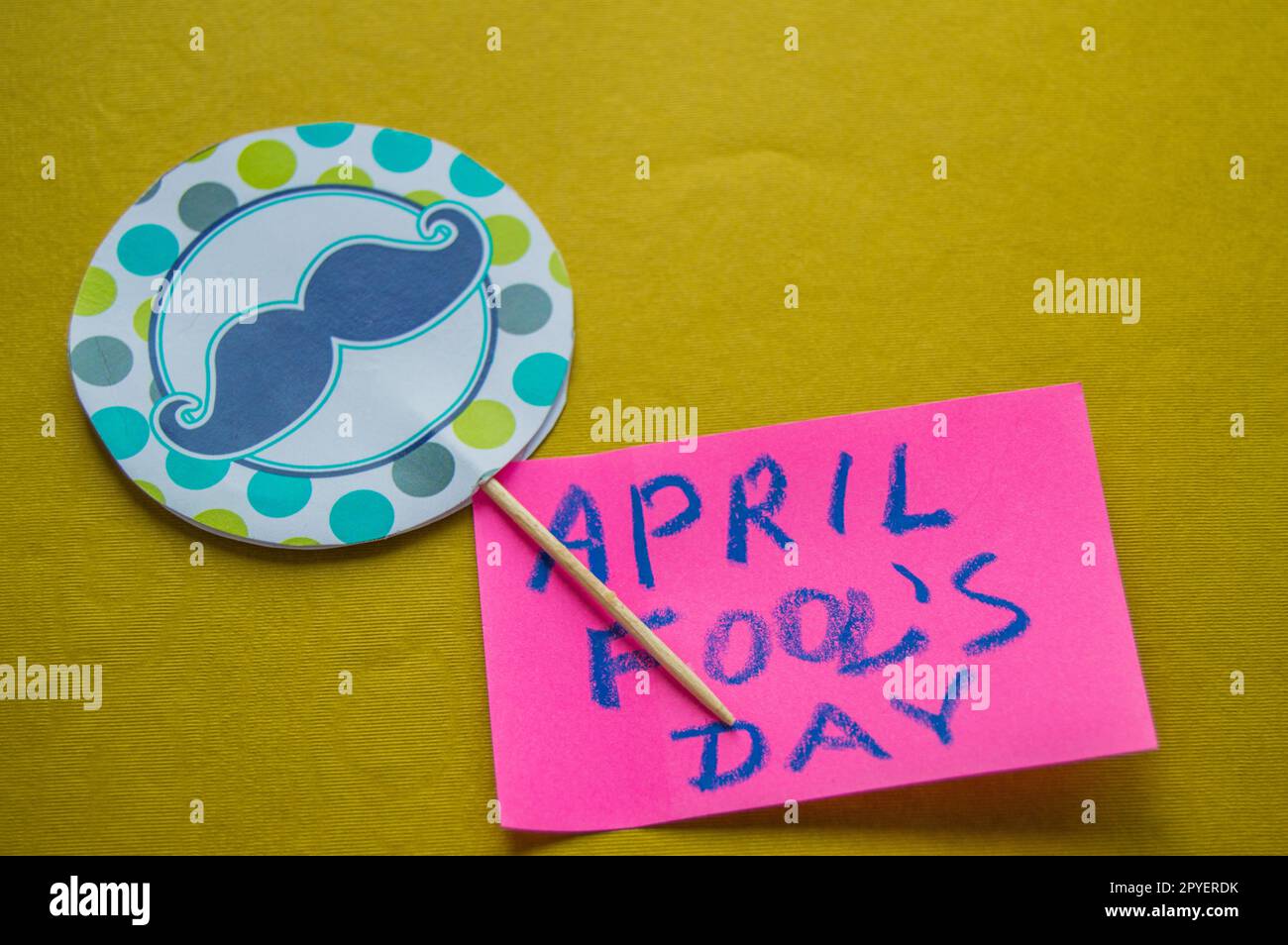 Paper topper with a painted mustache and the words April fool's day ...