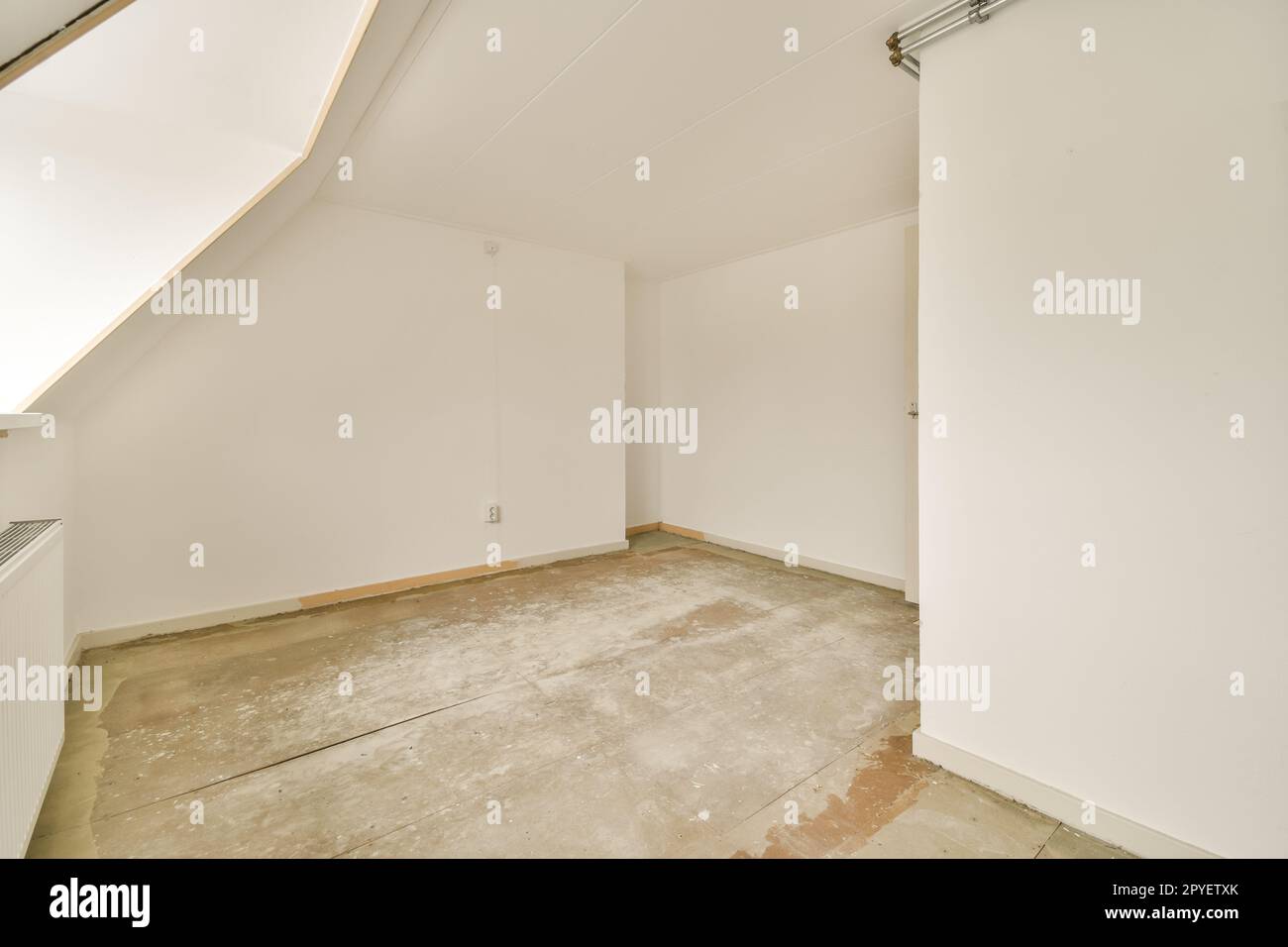an empty room with white walls and no one wall in the room is visible ...