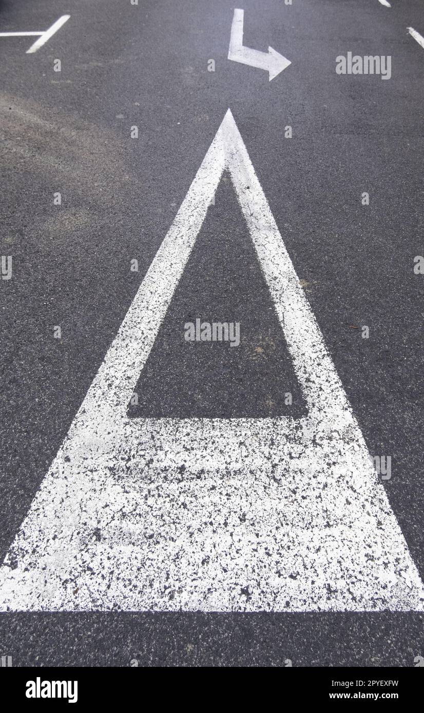 Yield sign on asphalt Stock Photo - Alamy
