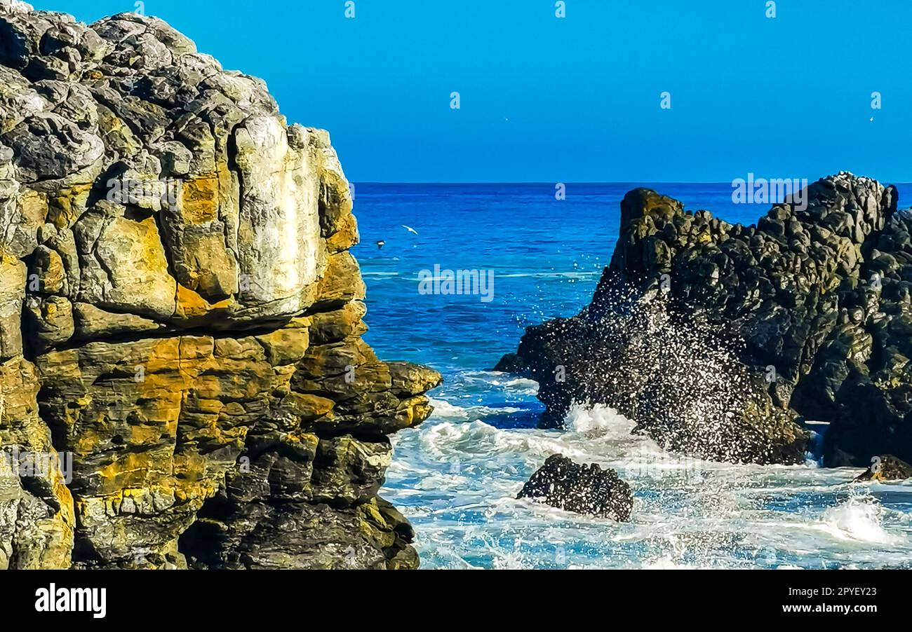 Beautiful rocks cliffs surfer waves at beach Puerto Escondido Mexico ...