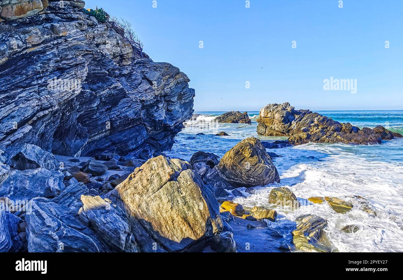 Beautiful rocks cliffs surfer waves at beach Puerto Escondido Mexico ...
