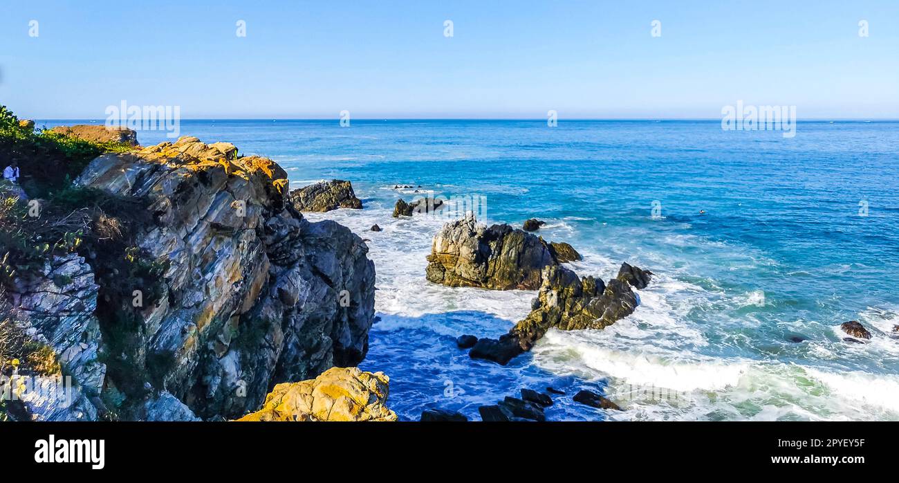 Beautiful rocks cliffs surfer waves at beach Puerto Escondido Mexico ...