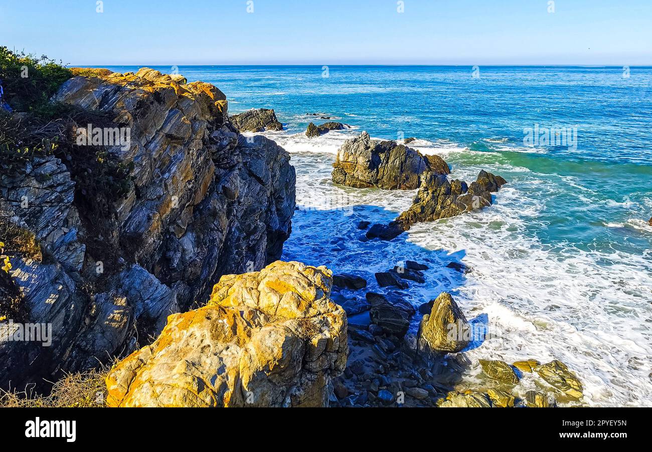 Beautiful rocks cliffs surfer waves at beach Puerto Escondido Mexico ...