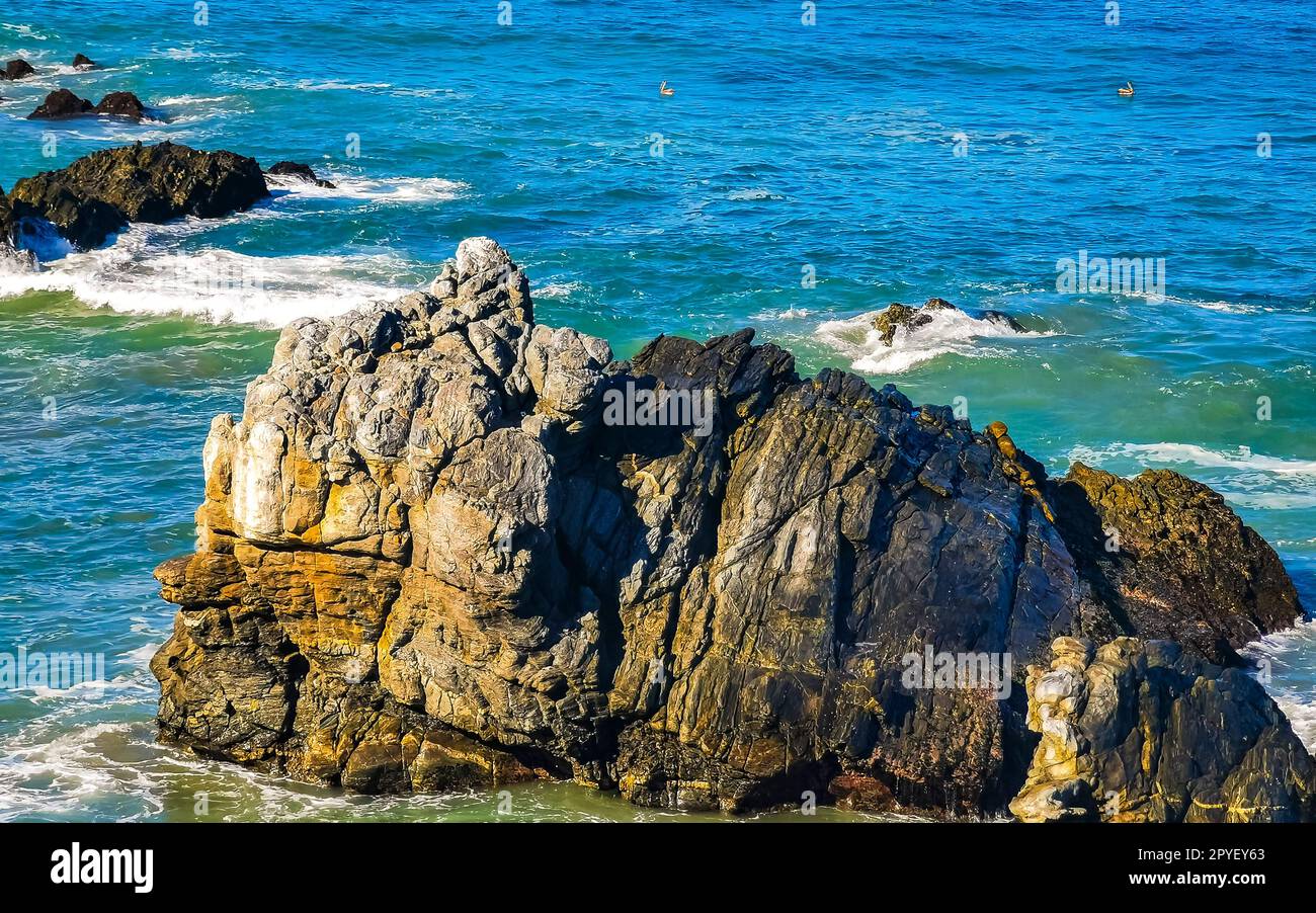 Beautiful rocks cliffs surfer waves at beach Puerto Escondido Mexico ...