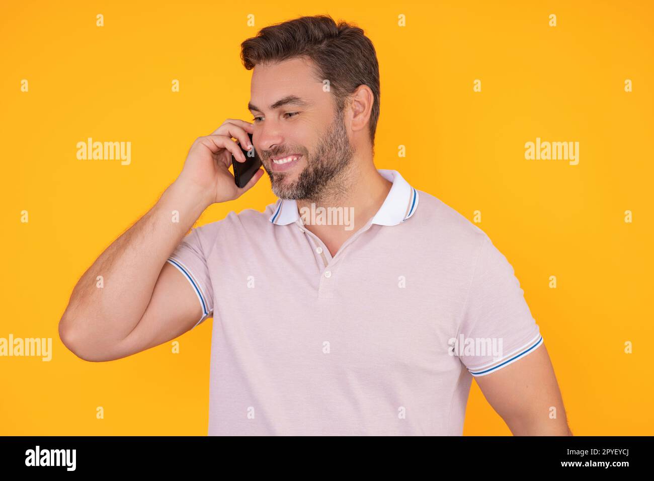 European business man watching on mobile phone. Handsome man wearing ...