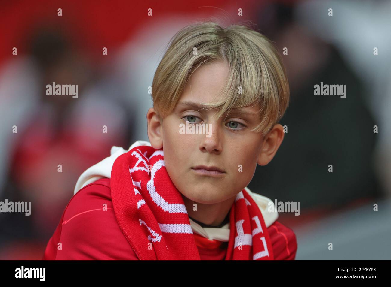 A young Liverpool fan arrives ahead of the Premier League match ...