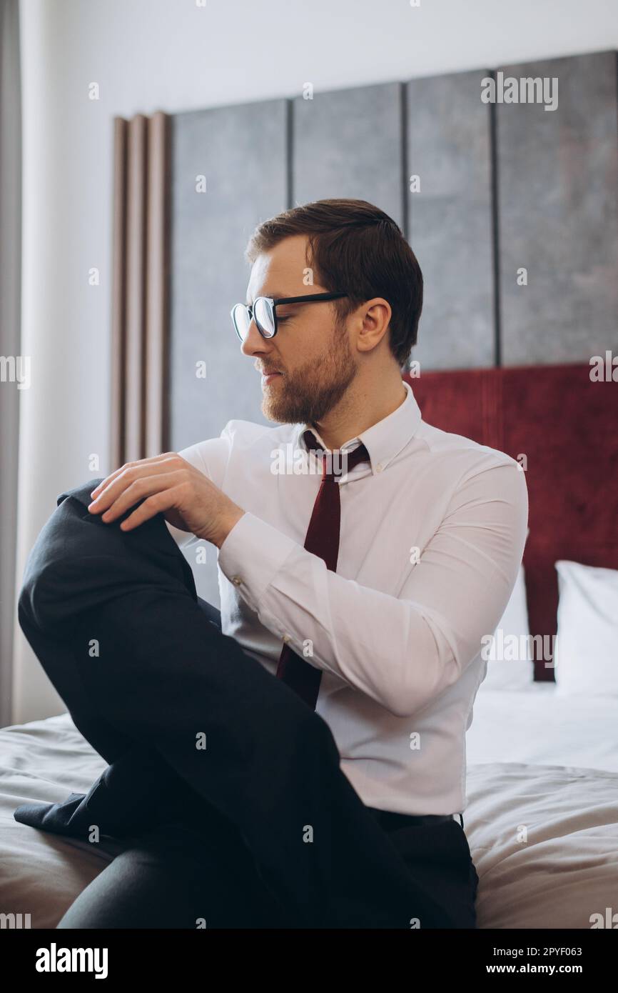 Taking off jacket hi-res stock photography and images - Alamy
