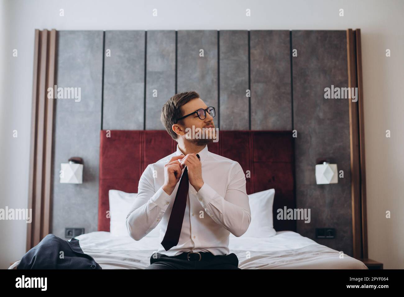 Businessman taking off tie hi-res stock photography and images - Alamy