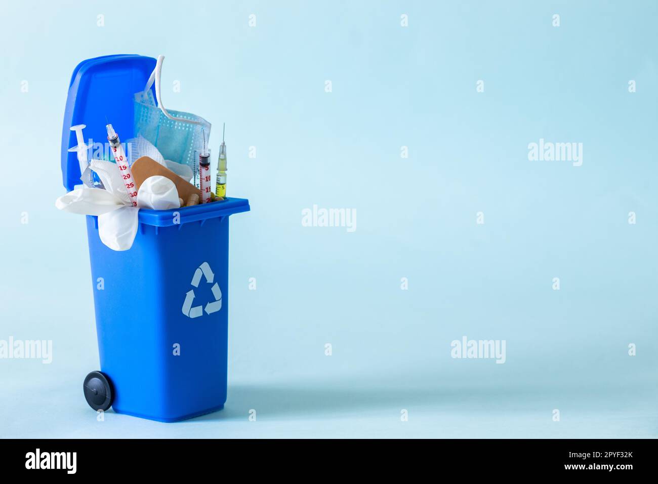 medical waste, Open dumpster full of pills, syringes, bandages, masks ...