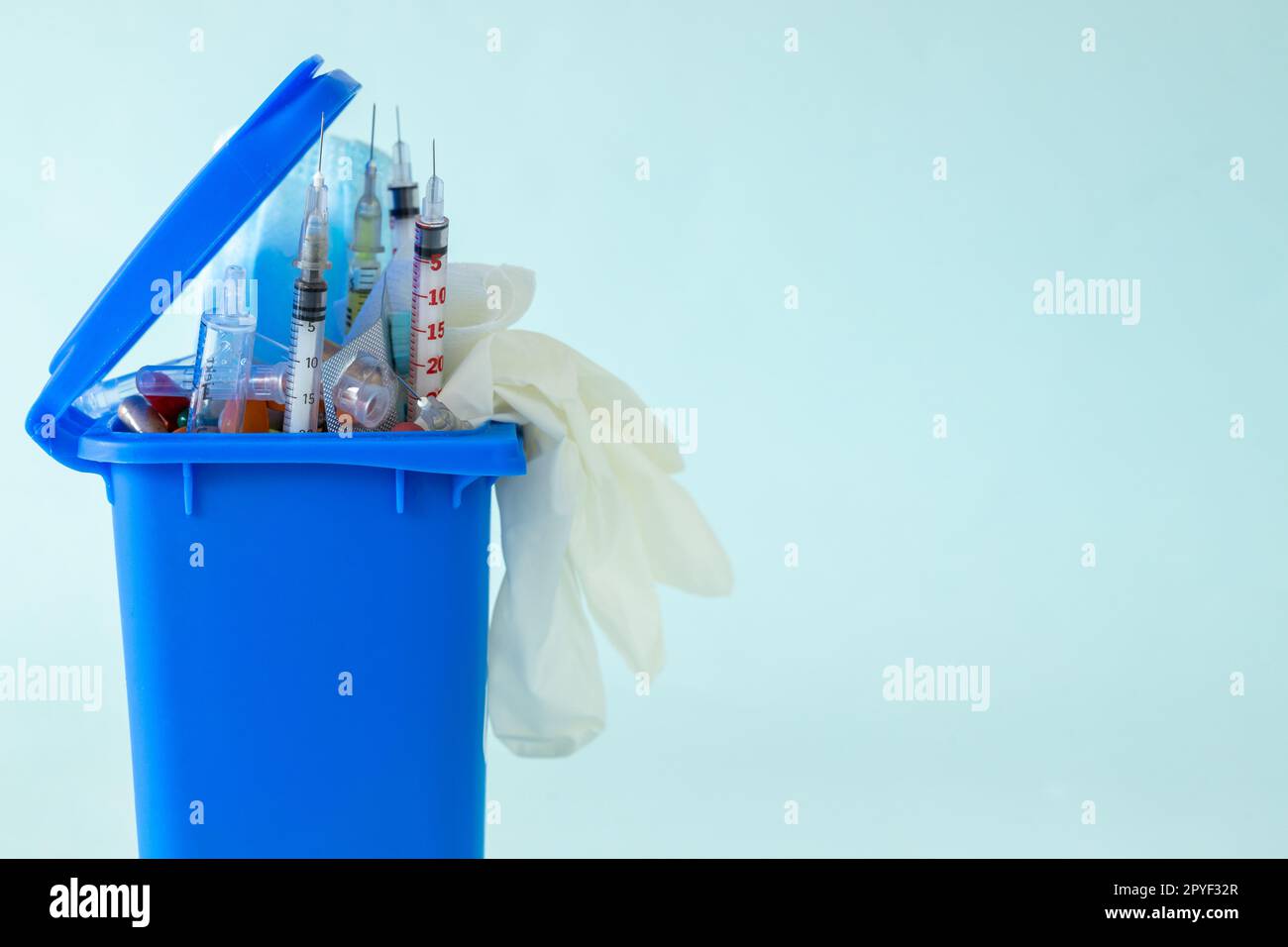 medical waste, Open dumpster full of pills, syringes, bandages, masks ...