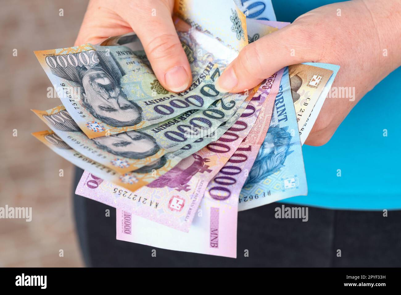 Hungarian forint money, Woman clutching a handful of banknotes, Large ...