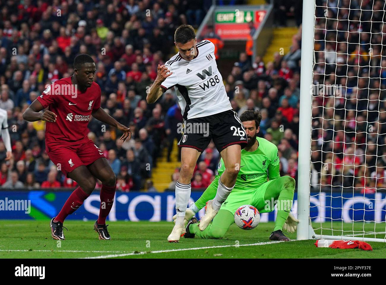 Liverpool goalkeeper Alisson Becker saves a back heel from Fulham’s ...