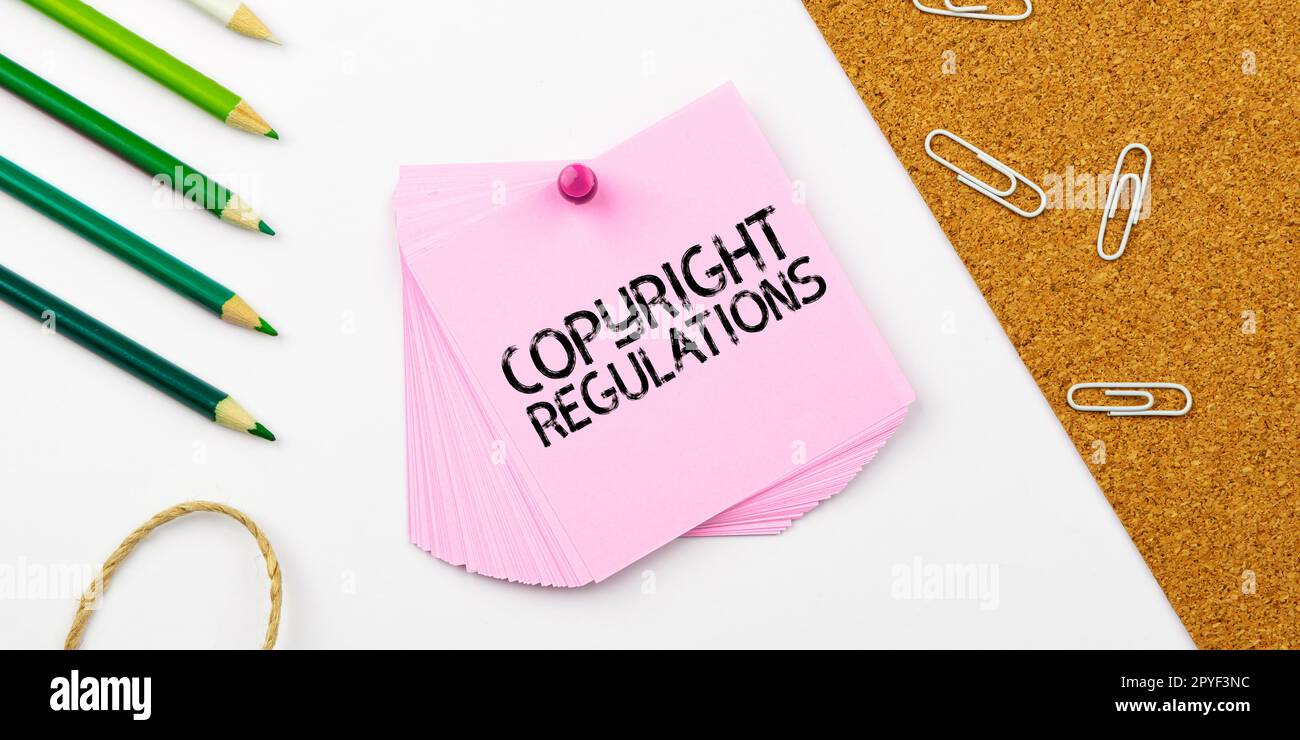 Sign displaying Copyright Regulations. Word Written on body of law that ...