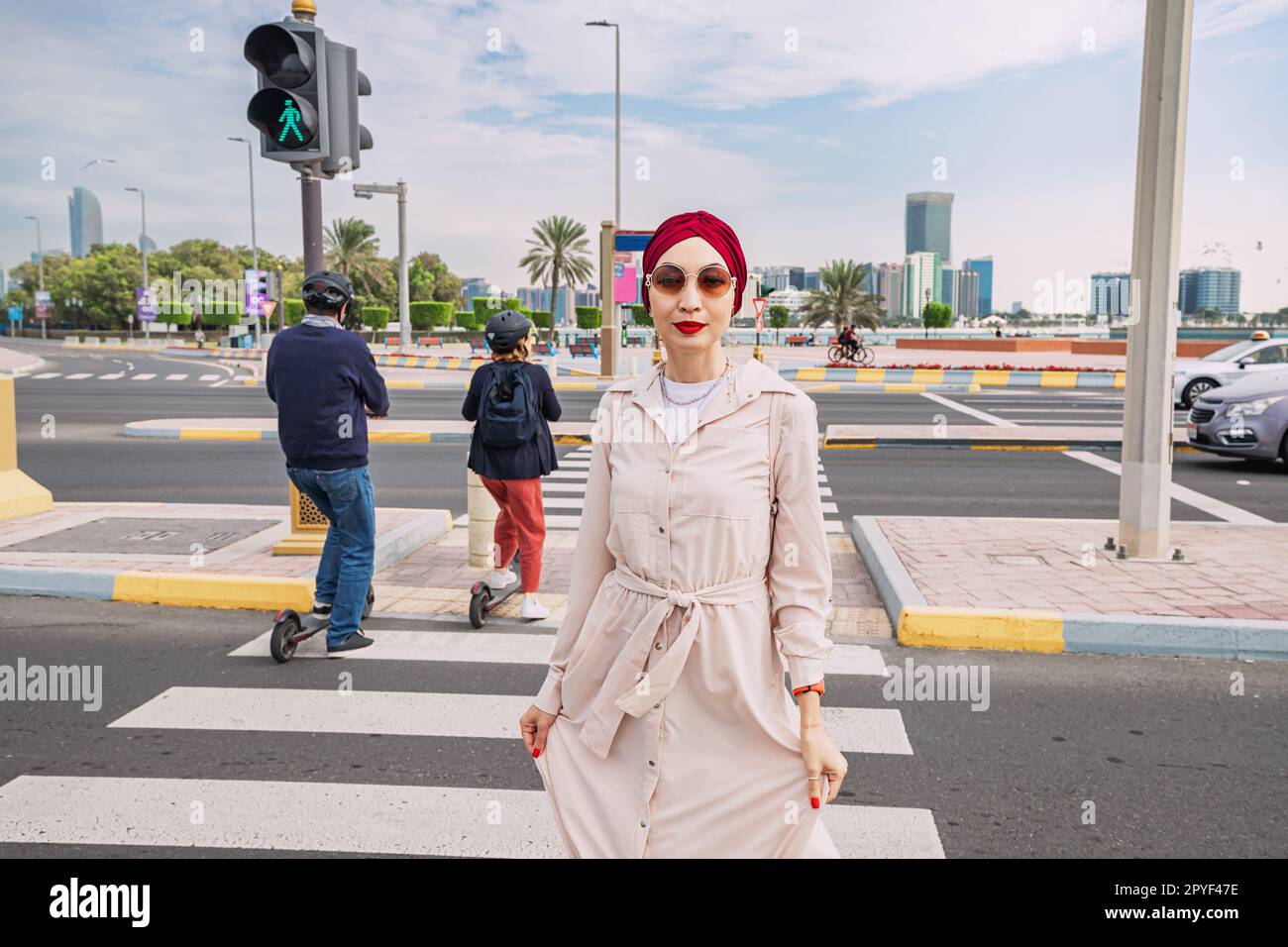 scooters and indian girl crosses the road at the zebra crossing. Rules ...
