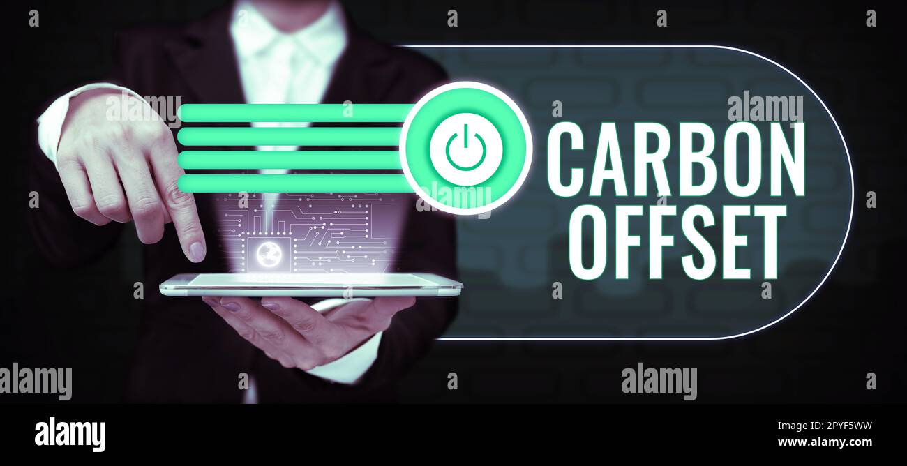 Sign displaying Carbon Offset. Word Written on Reduction in emissions ...