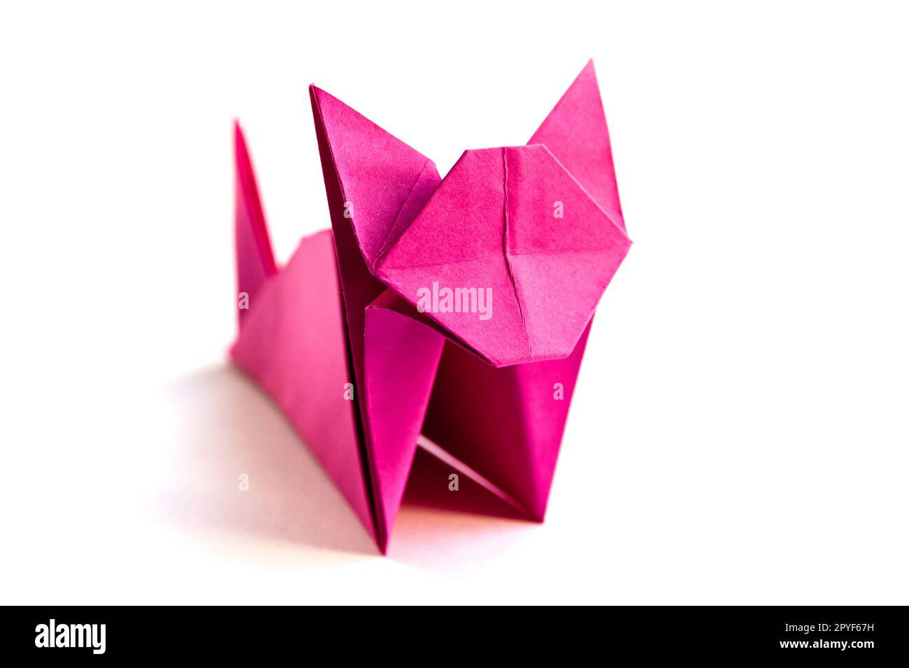 Pink paper cat origami isolated on a white background Stock Photo - Alamy