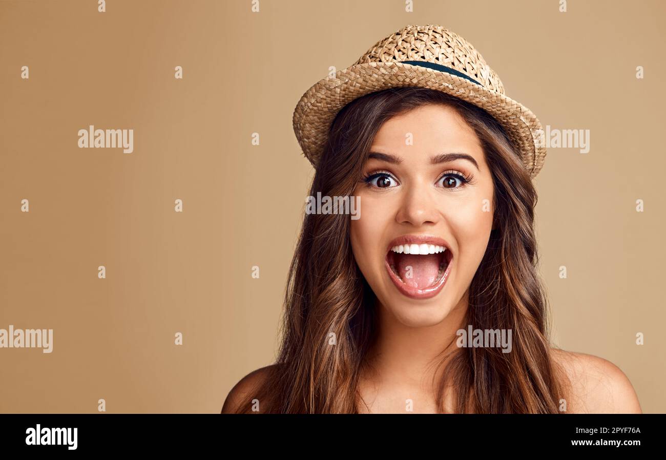 Thats amazing news. Studio shot of a beautiful young woman looking ...