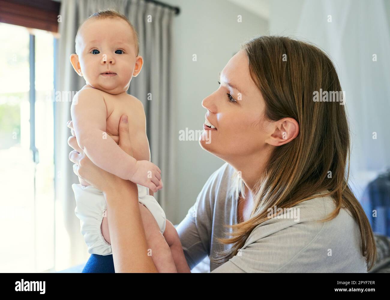 You mean everything to me. a young mother and her baby at home Stock Photo - Alamy