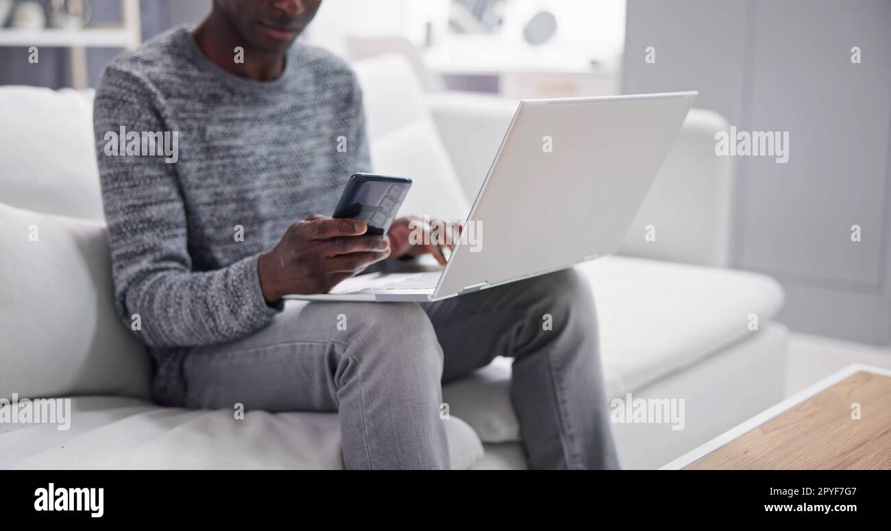 Sitting Home Using Computer Technology Stock Photo - Alamy