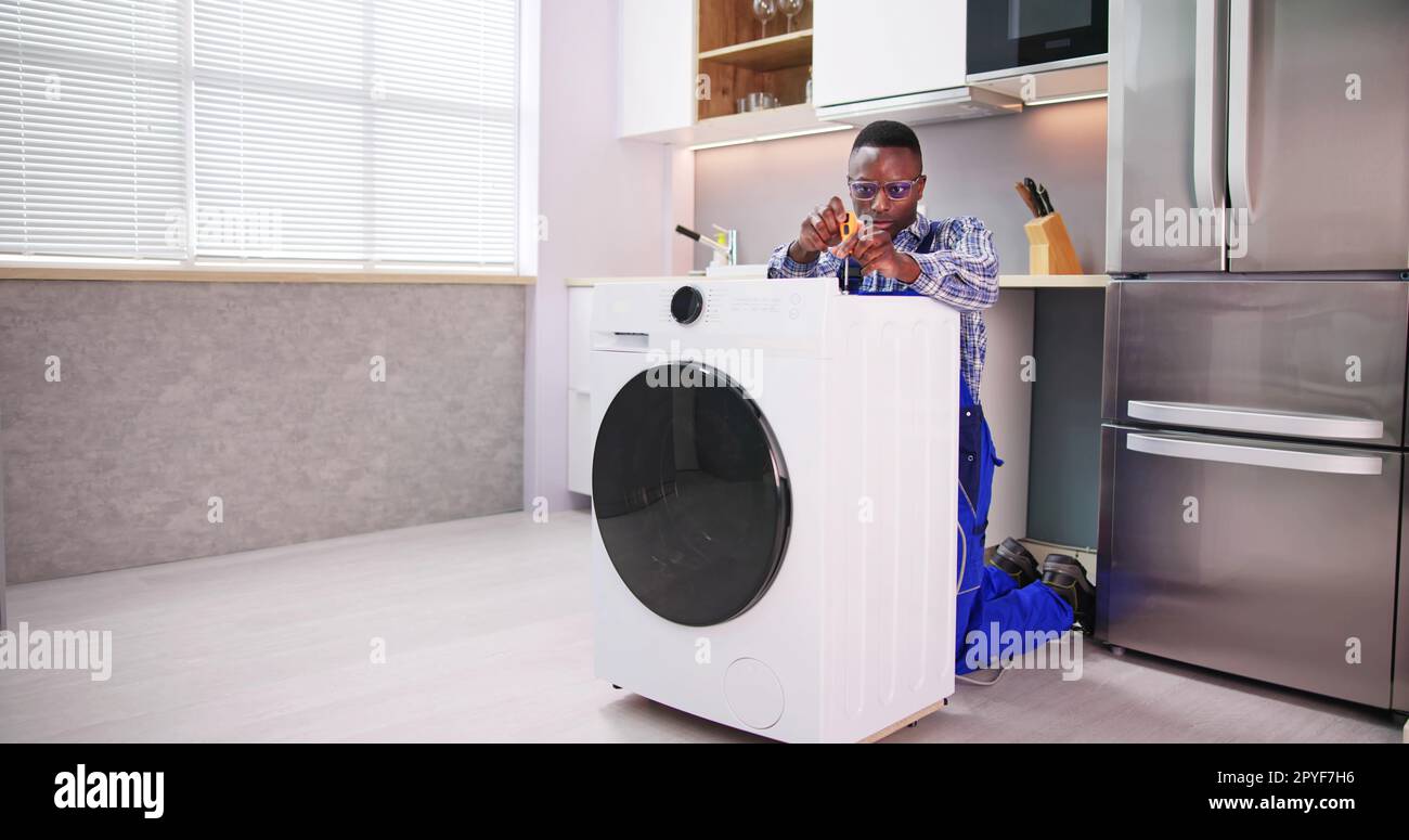 Washing Machine Appliance Repair And Install Stock Photo - Alamy