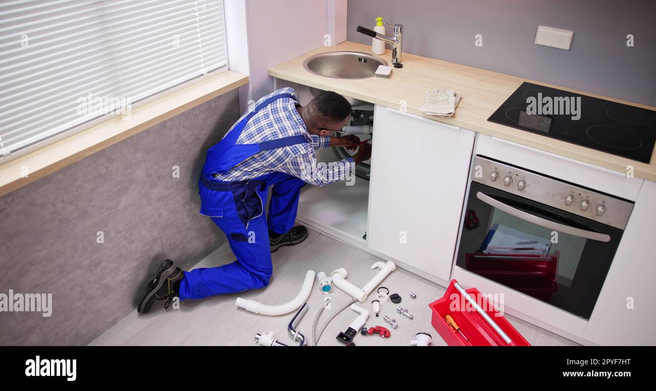 Kitchen plumber hi-res stock photography and images - Alamy