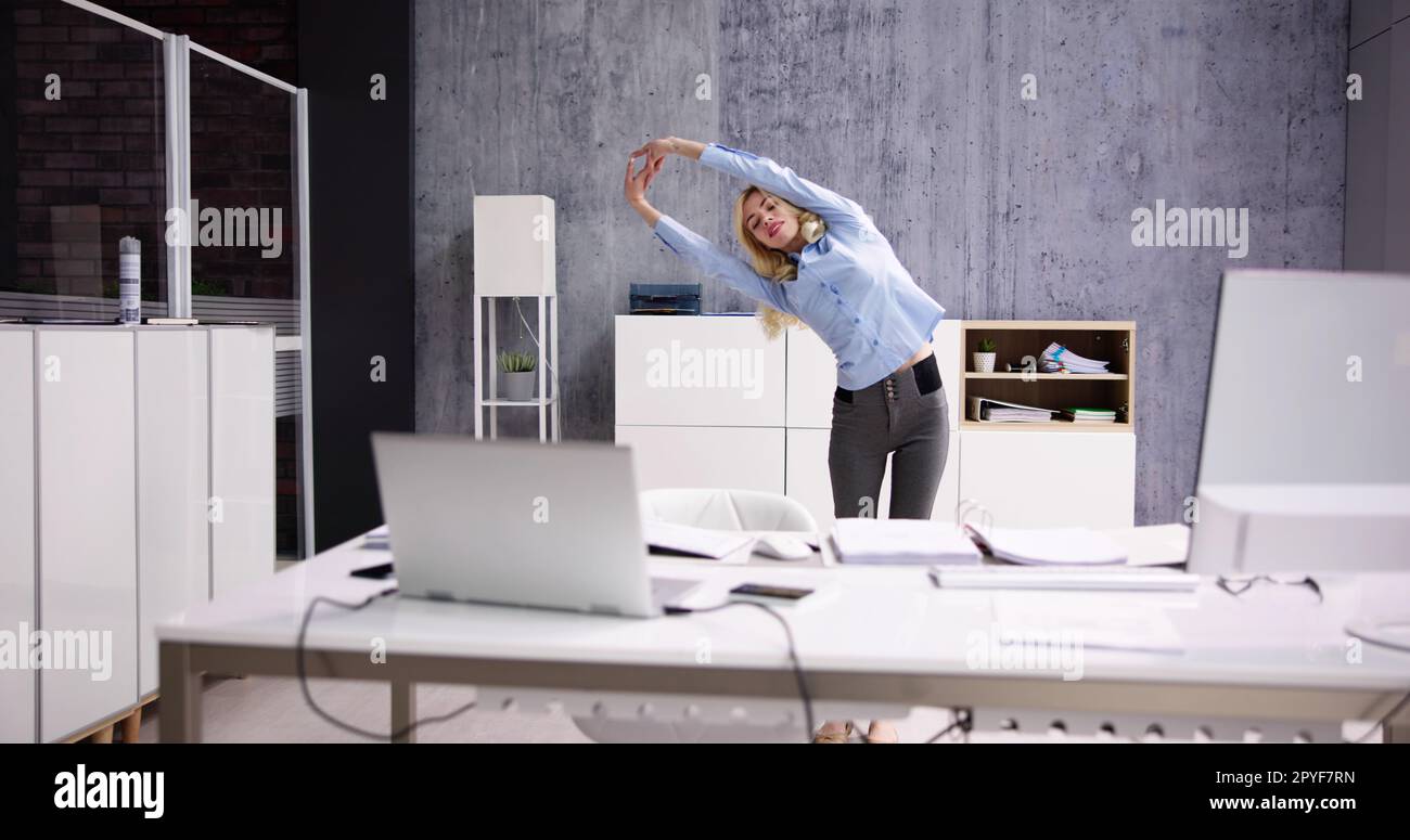 Arms Stretch Exercise Standing Near Desk Stock Photo - Alamy