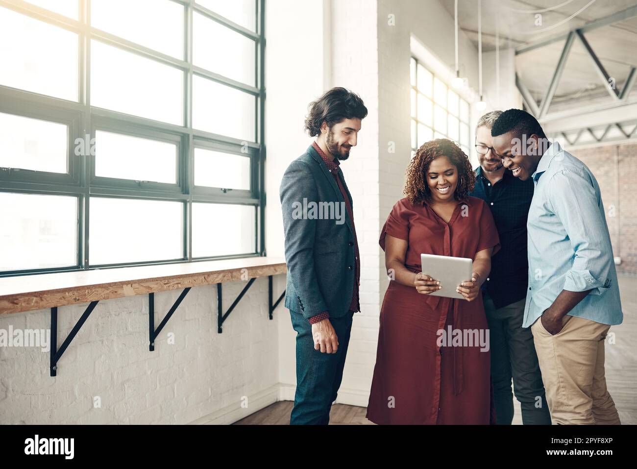 Taking care of team tasks with smart apps. a group of businesspeople ...