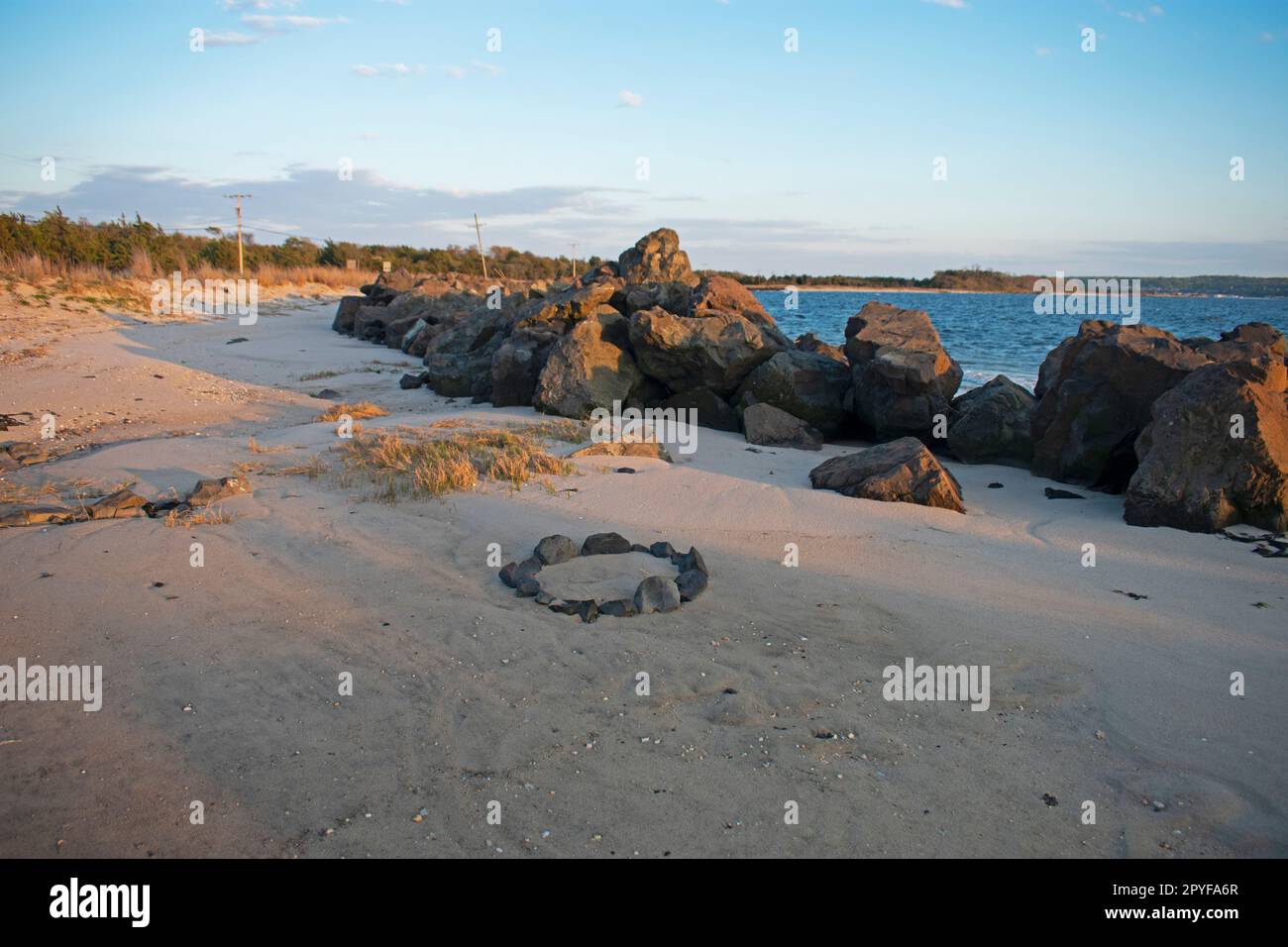 Large boulders line the shore at a Sandy Hook, New Jersey, bayside ...