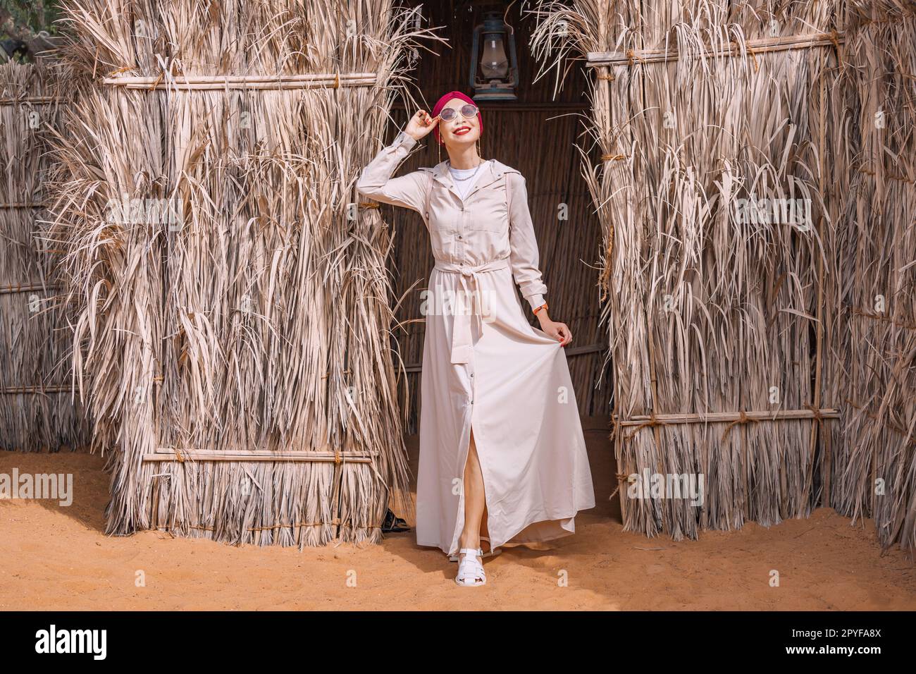 Girl in indian turban exploring arabian heritage village in Abu Dhabi ...