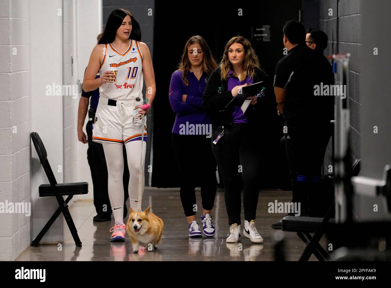 Phoenix Mercury center Megan Gustafson (10) walks her dog through the ...