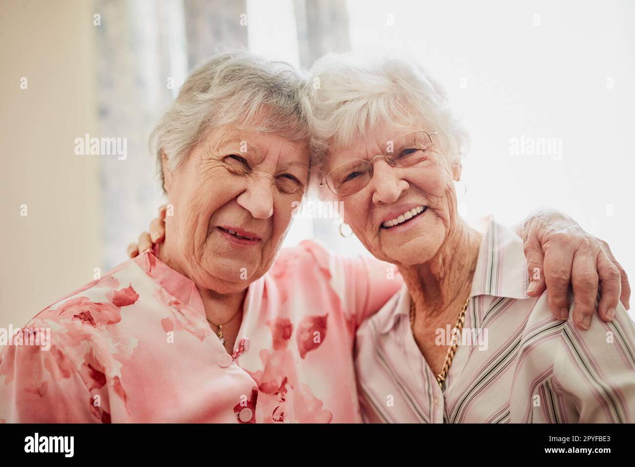 Two old friends hugging each other hi-res stock photography and images ...
