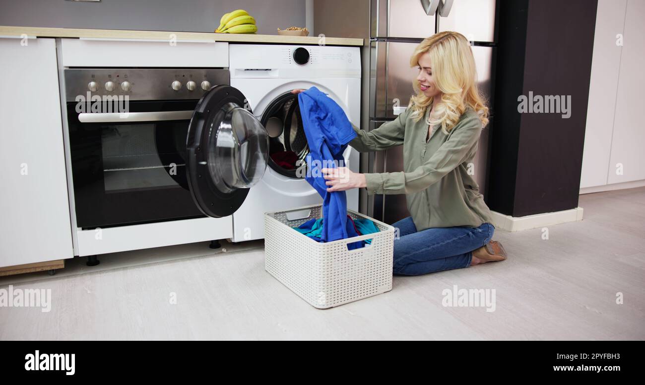 Putting laundry in the washing machine hi-res stock photography and ...