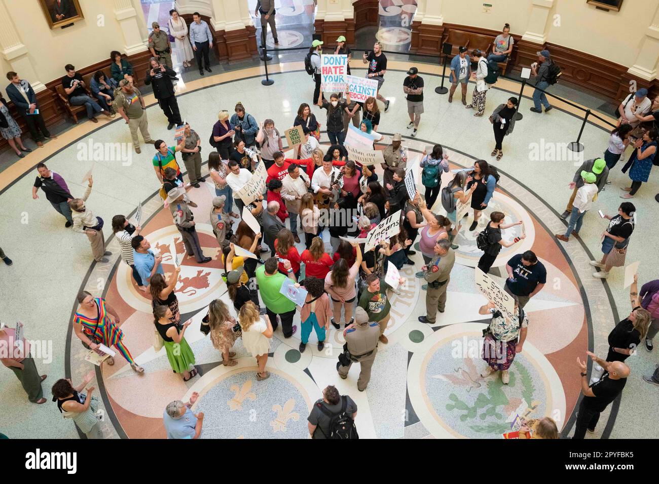 Austin, TX, USA. 2nd May, 2023. LGBTQ activists surround members of the ...