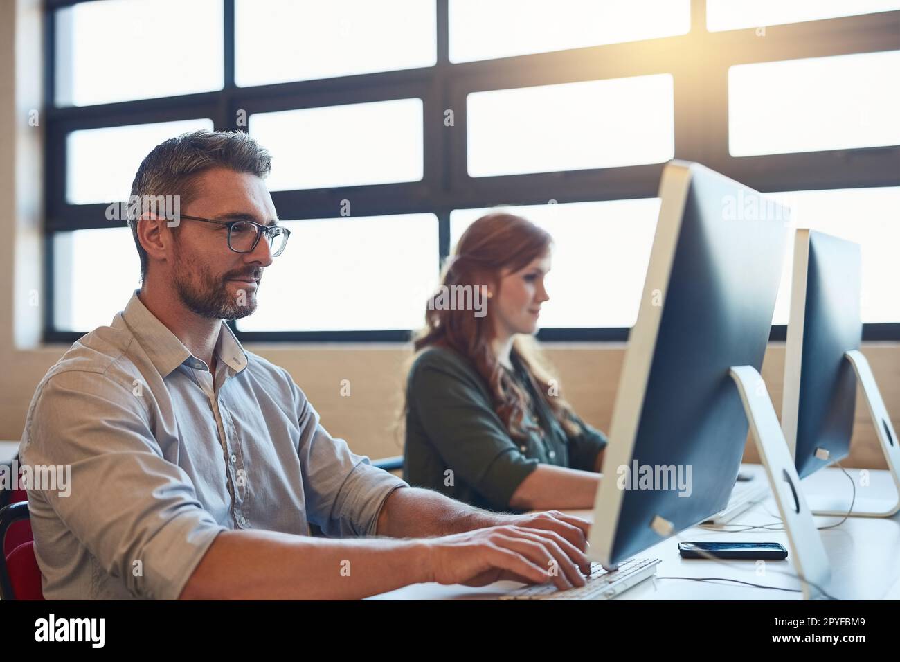 Two man working hard hi-res stock photography and images - Alamy