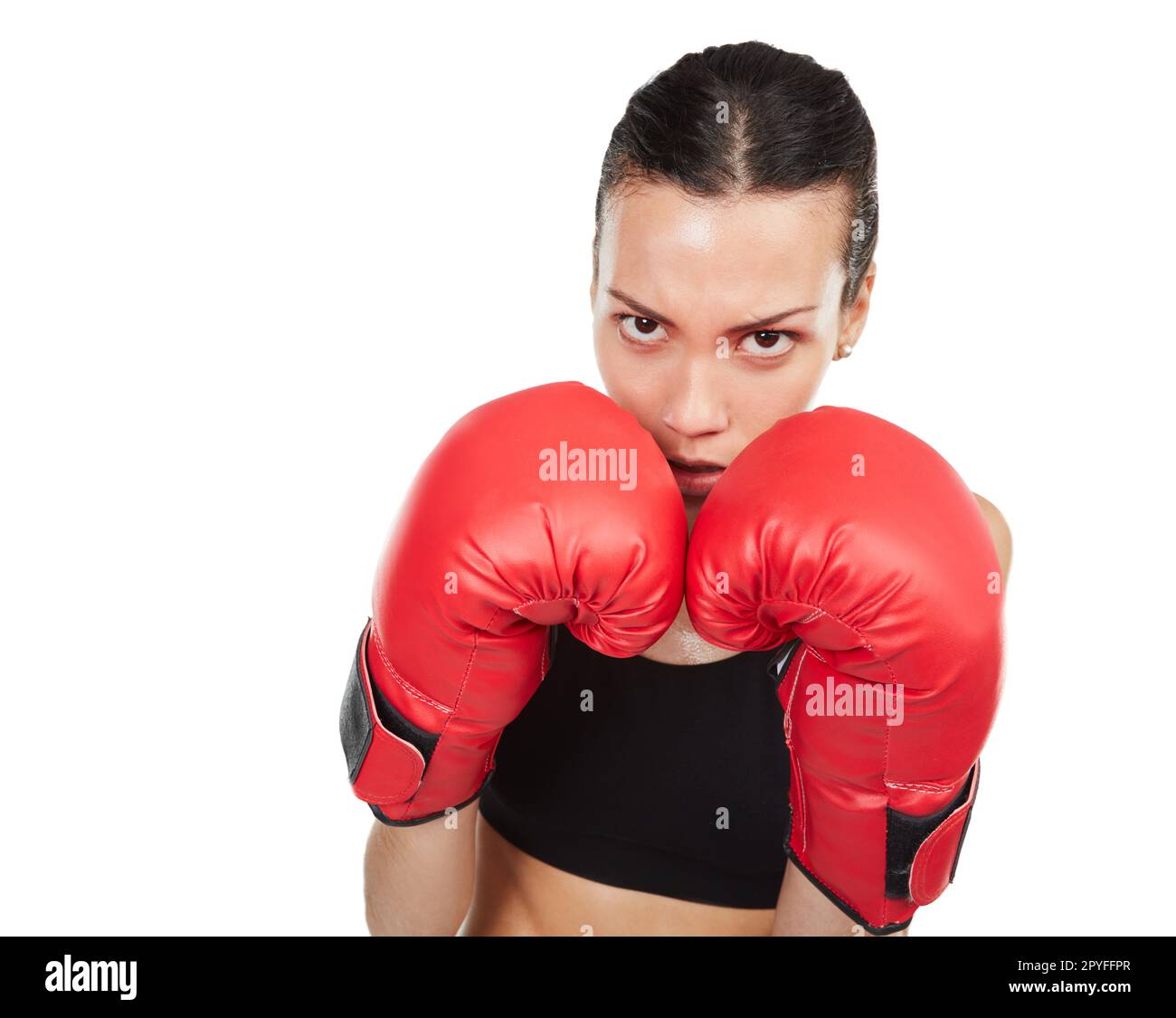 Keep your guard up. Cropped portrait of a young female athlete boxing ...