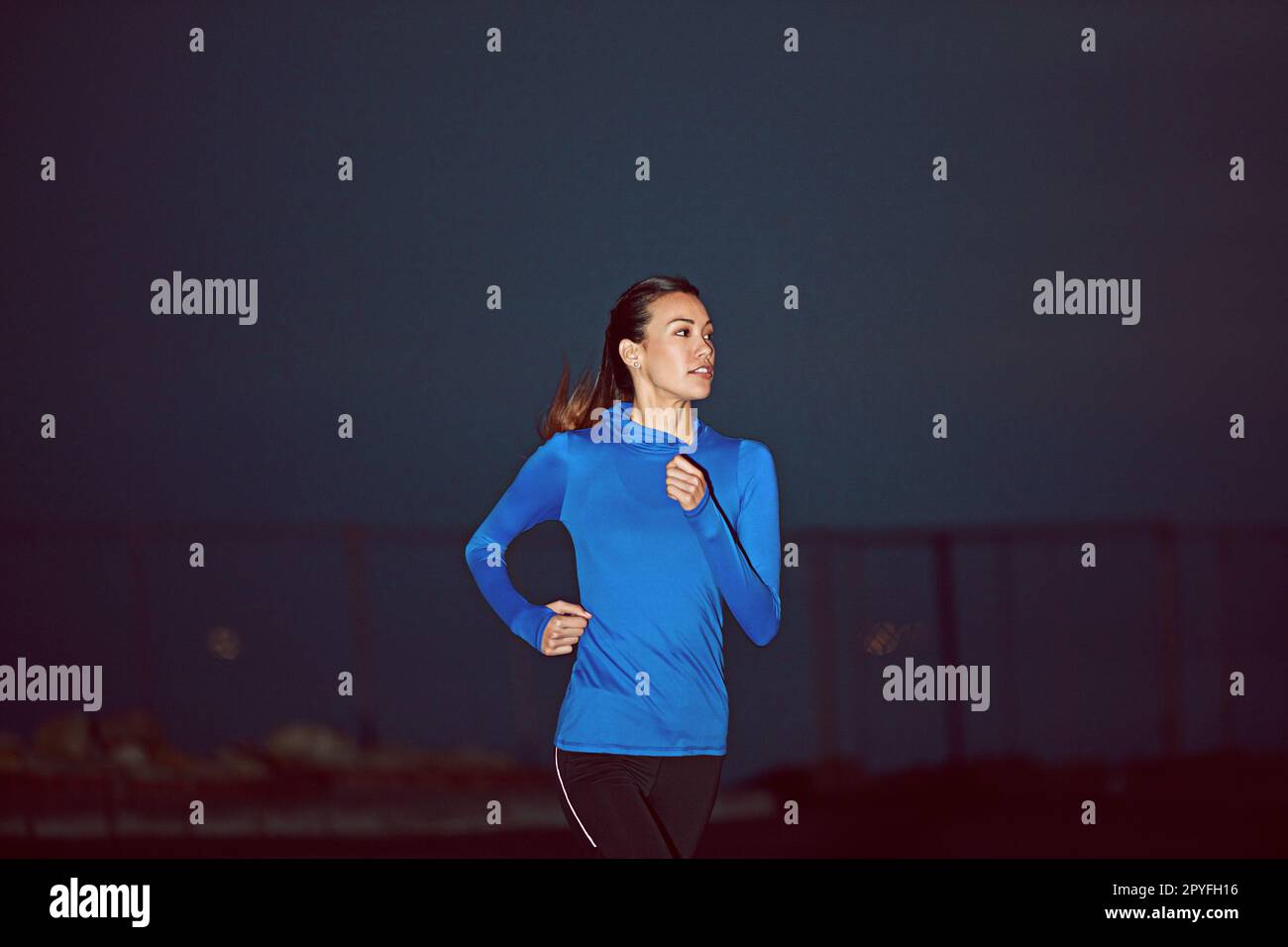 Woman running at night hi-res stock photography and images - Alamy