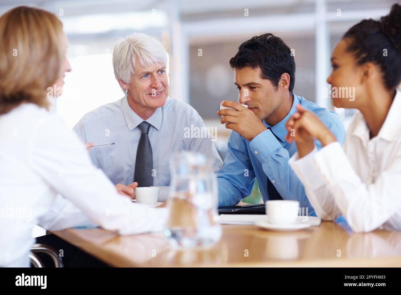 Business group discussion. Portrait of senior leader with his ...