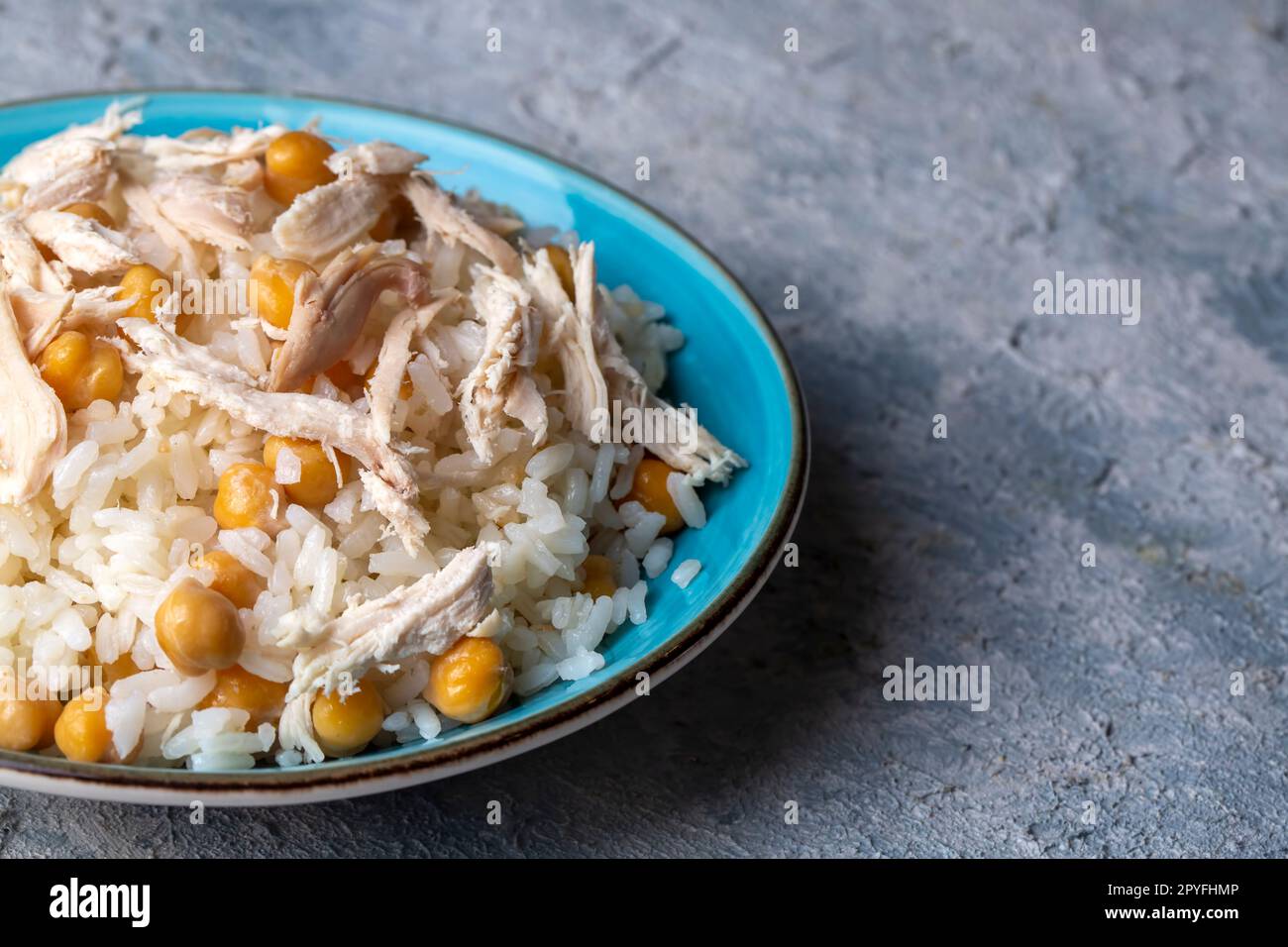 Traditional delicious Turkish food; Rice with chickpeas and chicken ...