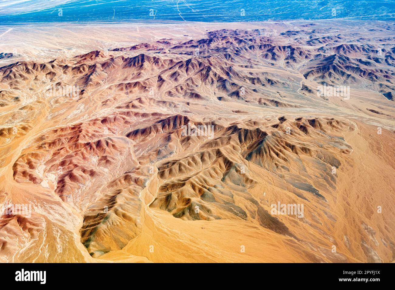Aerial view of dry rivers and mountains in the altiplano of the Atacama ...