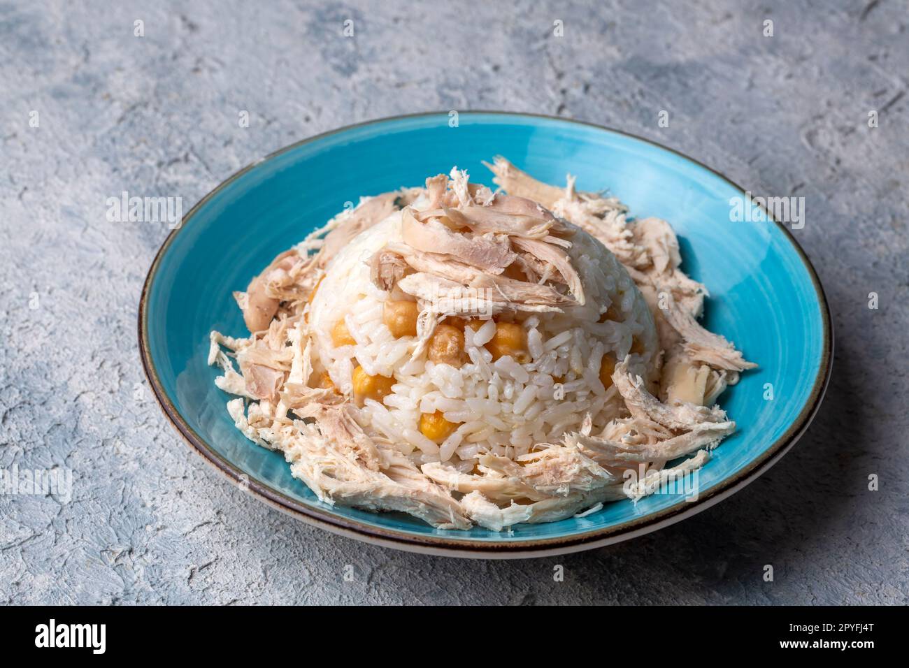 Traditional delicious Turkish food; Rice with chickpeas and chicken (Turkish name; Tavuklu ...