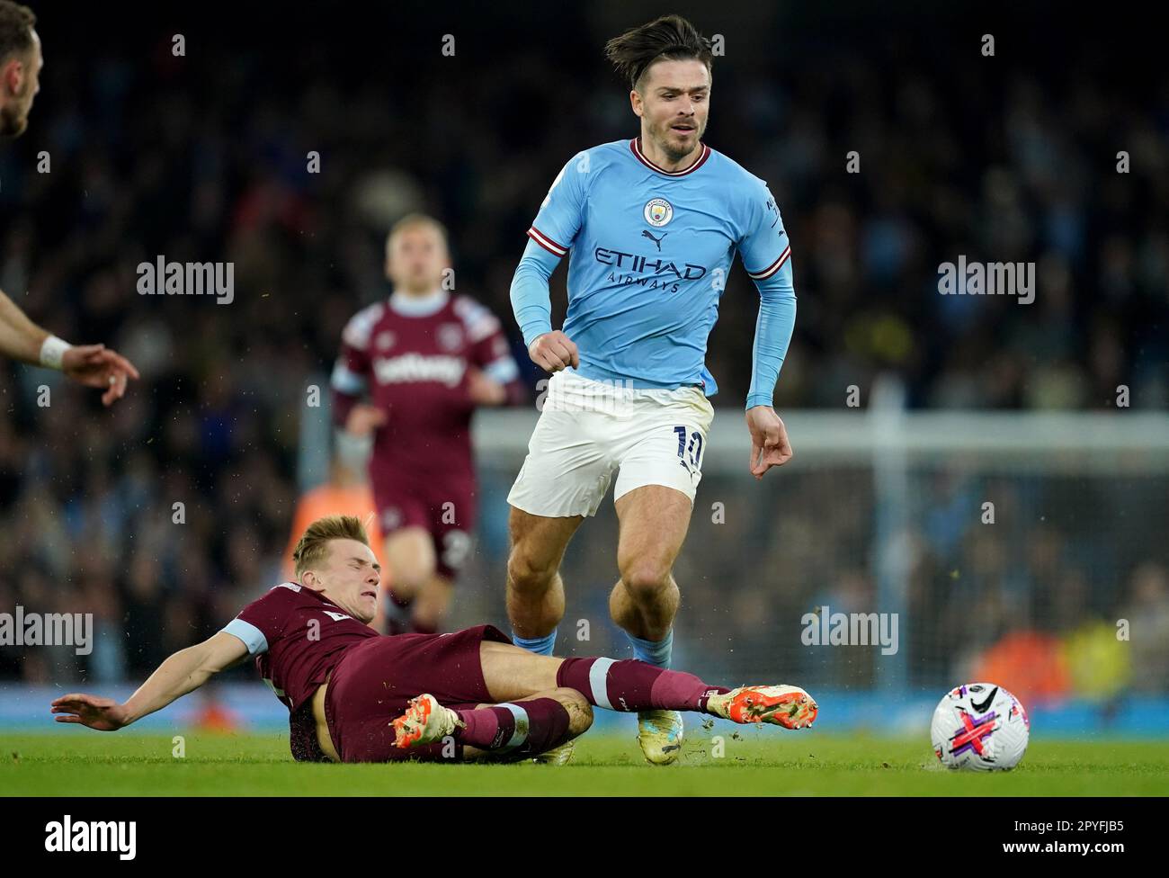 West Ham United's Flynn Downes (left) fouls Manchester City's Jack ...